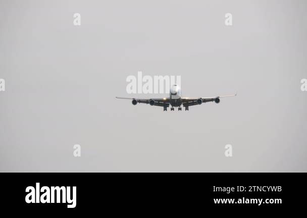 Heavy wide-body cargo airliner landing approach, long shot. Transport ...