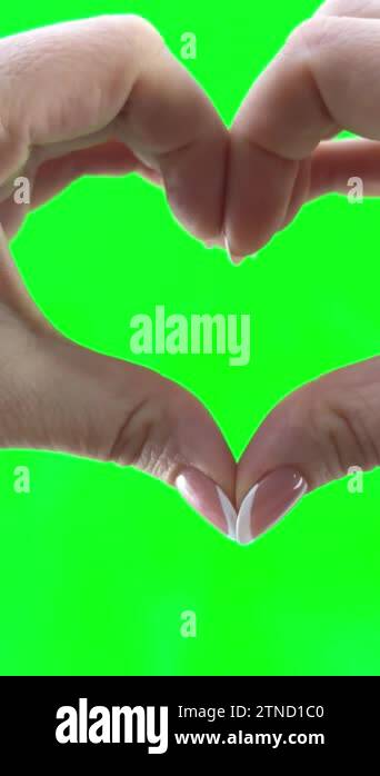 A hand heart. Person forms a heart shape using their fingers. Two ...