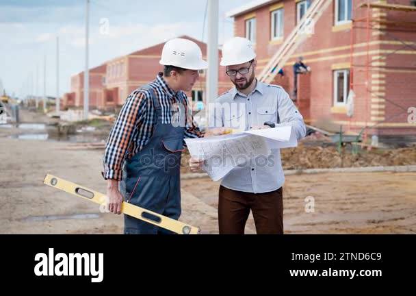 Team of builders at work. Foreman and builder with building level Stock ...