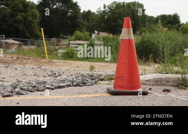 single tall beat up marked pylon with black bottom and thick white ...