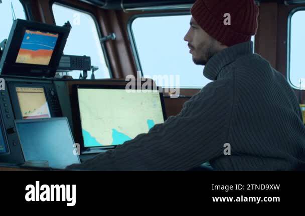 Captain of Commercial Fishing Ship Surrounded by Monitors and Screens ...