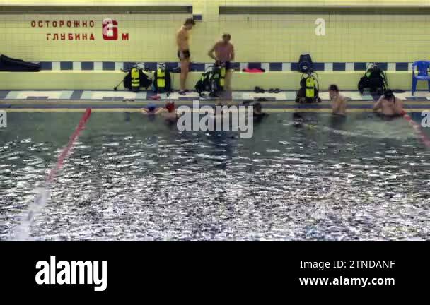 Coach and diving group in swimming pool Stock Video Footage - Alamy