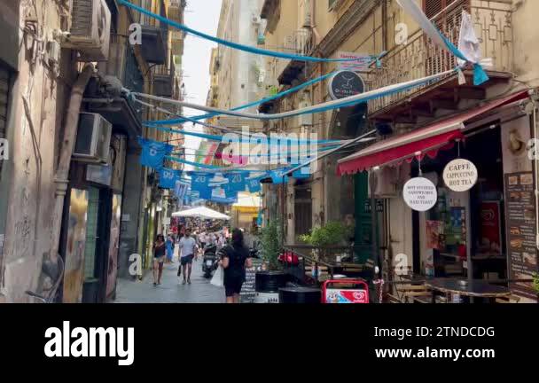 Via dei Tribunali central busy street in Napoli old town. Italian ...
