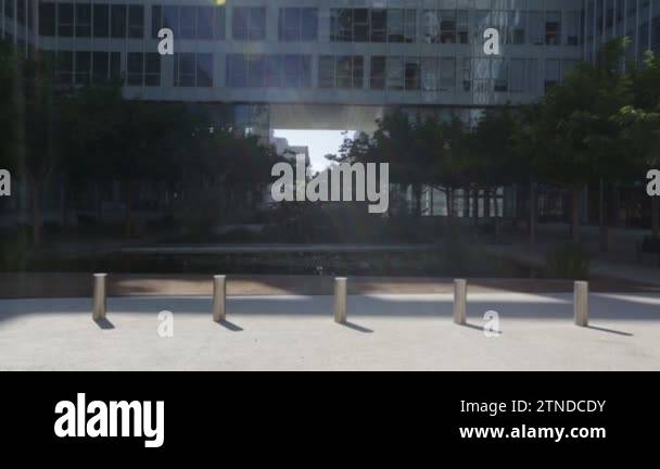 day Up angle Tilt up over modern tall large glass high rise office ...