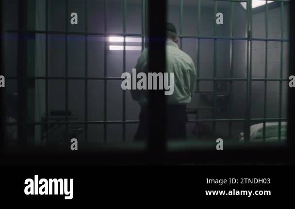 Criminal hits prison officer, takes keys, opens prison cell. Prisoner ...