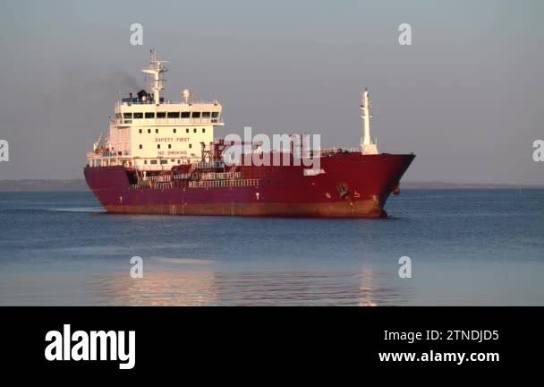 A containerized cargo ship enters the port for unloading. Big container ...