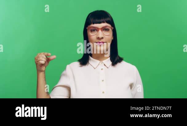 Sign language, hand gesture and face of woman in studio for ...