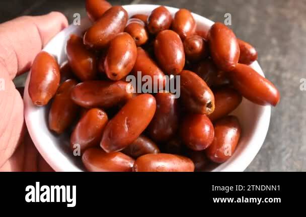 Date palm fruits. Its other names Phoenix dactylifera. Itis a flowering ...