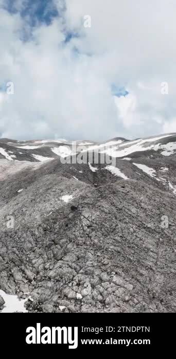 Soar above a majestic mountain range and capture the beauty of its snow ...