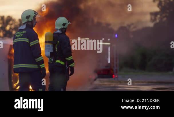 Firefighters fight the fire flame to control fire not to spreading out ...