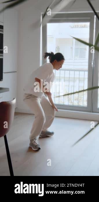 Vertical view of the young asian female dancer dancing hip hop dance at ...
