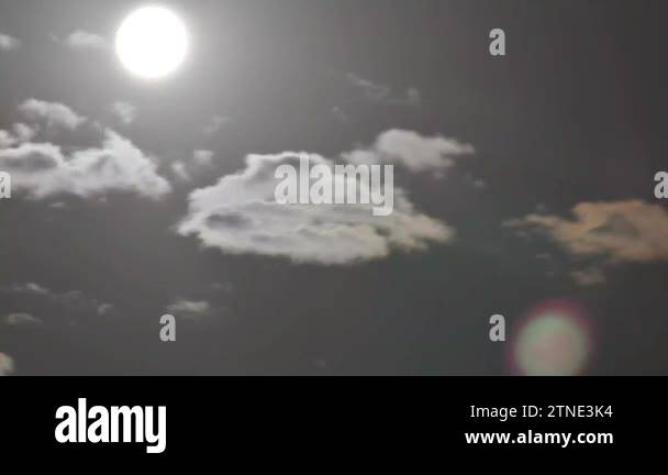 Time lapse of night sky with full moon. Full moon in dark night sky ...