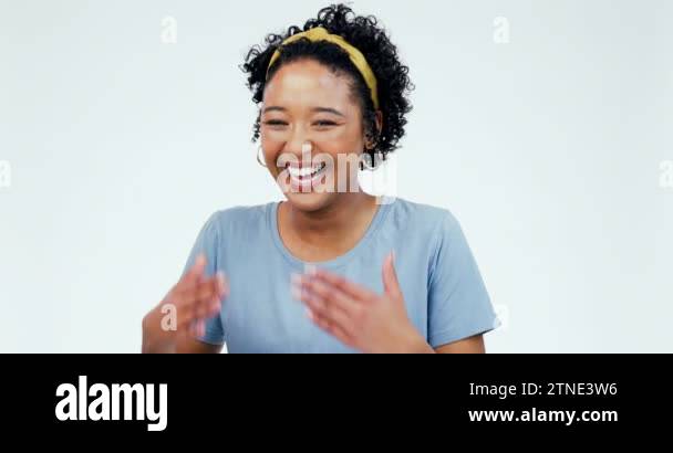 Surprise, joke and laughing woman face in studio with shy hands, humor or comic on white ...