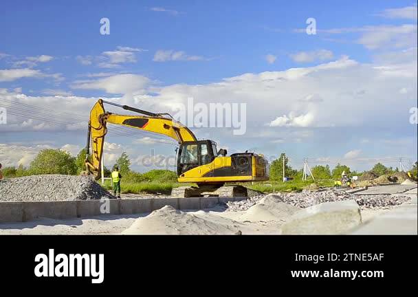 Excavator digging bucket on construction of high-speed ring road around ...