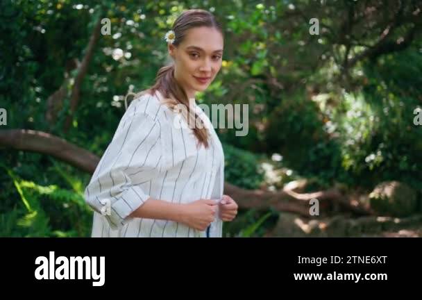 Gentle girl walking park at lush greenery sunny summer day close up ...