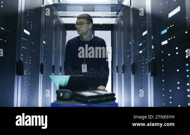 Following Shot of Server Engineer Pushing Crash Cart with Laptop, Hard ...