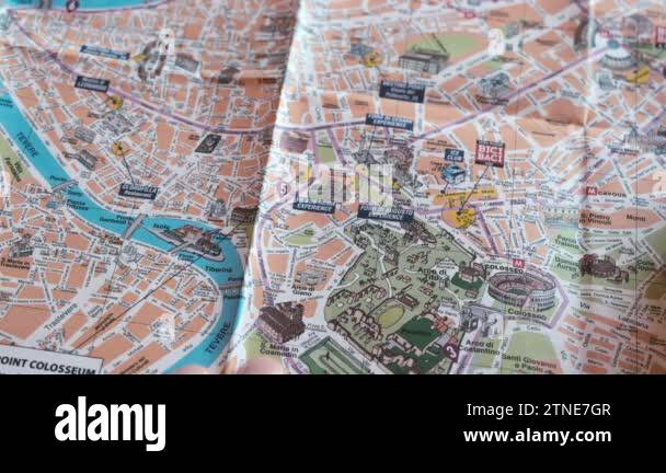 Rome, ITALY - June 15, 2023: Tourist studying the tourist map of Rome ...