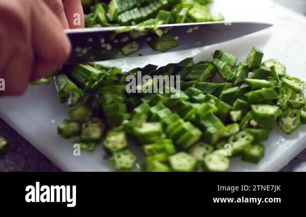 cutting ladies fingers with knife Stock Video Footage - Alamy