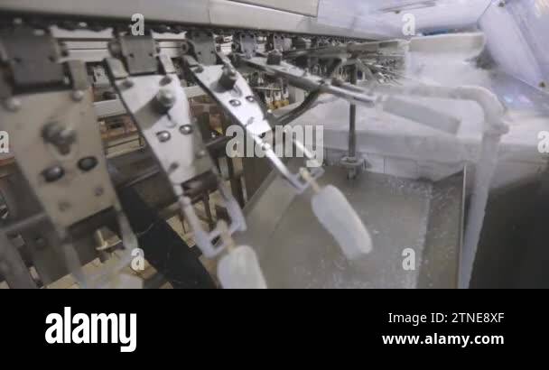 Freezing ice cream on the conveyor. Ice cream production process ...