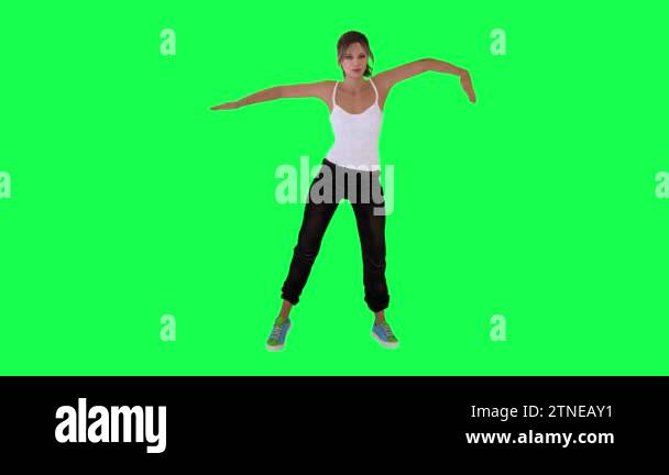 Beautiful young woman in white dress black pants and blue shoes dancing ...