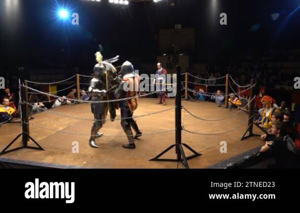 Two Medieval Knights Fighting In The Arena With Clubs And Shields Stock ...