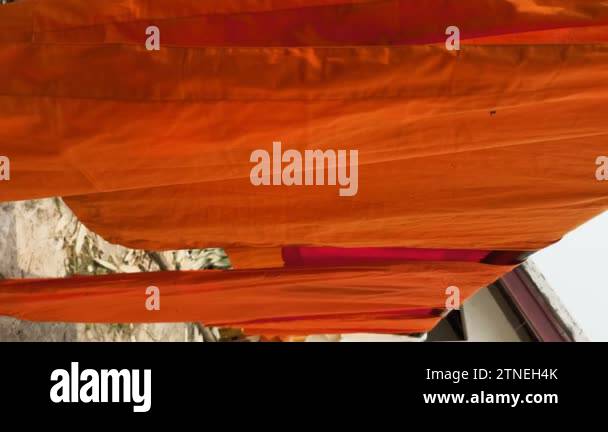 The robes of Buddhist monks hang out to dry after washing. Monks robes ...