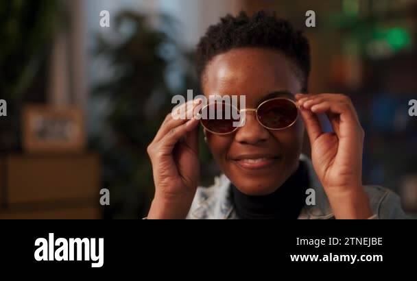 Photo captures the charm of an African woman wearing pink sunglasses ...