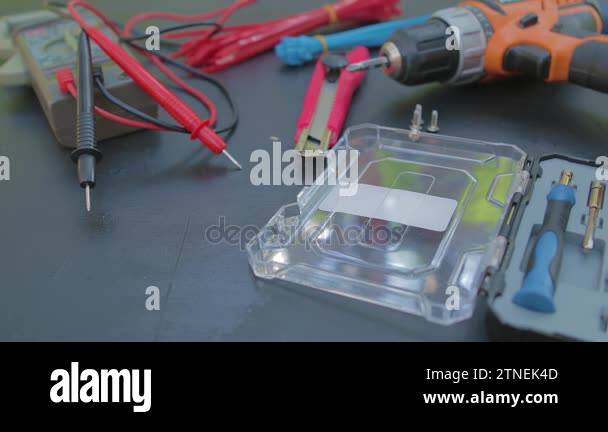 Slow panorama of different tools instruments, include multimeter, knife ...