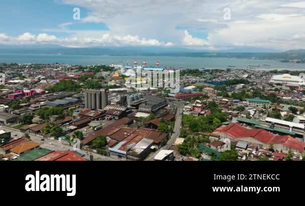 Cagayan de Oro with modern buildings under blue sky and clouds ...