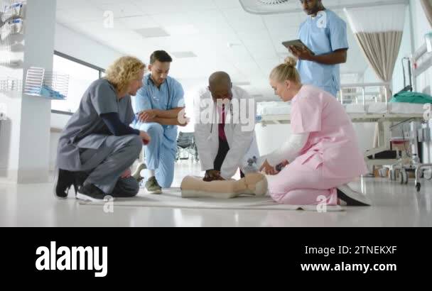 African american doctor training trainee doctors in emergency cpr ...