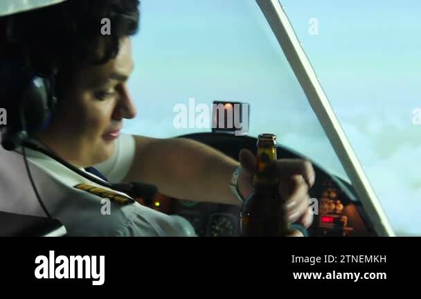 Insane captain of airliner drinking beer with co-pilot in cockpit ...