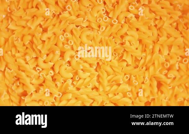 Uncooked Fusilli and Chifferi Rigati Pasta - Top View. Fat and ...