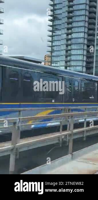 sky train road from Surrey to Vancouver passing trains skyscrapers ...