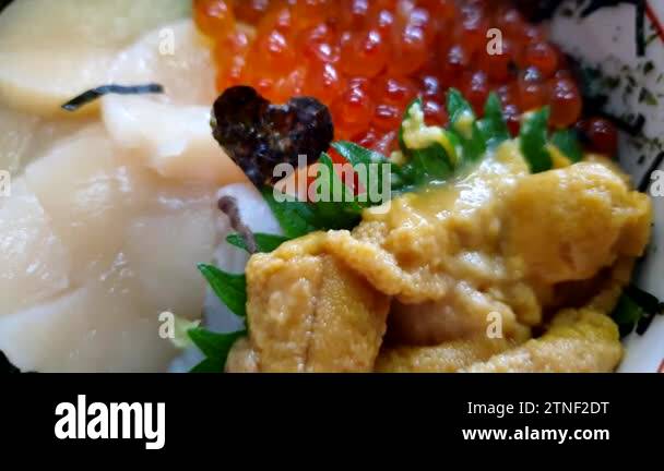 Hakkaido raw seafood rice topping scallop sea urchin and salmon roe ...