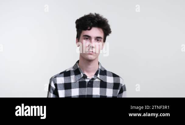 A charismatic curly-haired man on white background. With unwavering ...