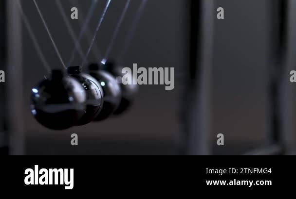 Newtons cradle physics concept for action and reaction or cause and ...