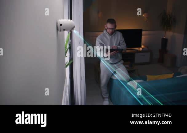 Man sets up security camera with AI recognition at home using digital ...