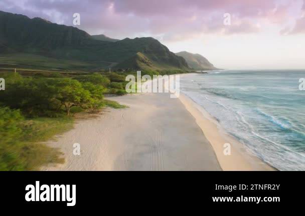 Tourist exploring Makua beach at sunset, Oahu island Hawaii. Traveler ...