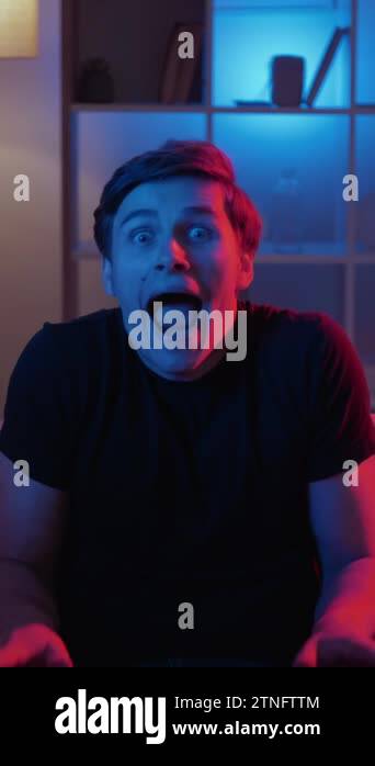 Vertical video. Grimacing man. Meme expression. Silly behavior. Foolish ...