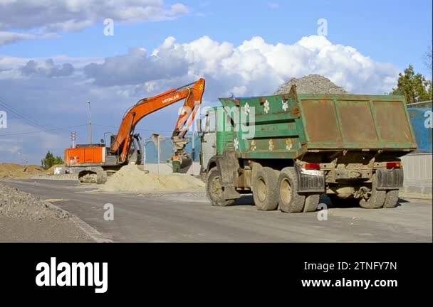 Excavator digging road construction Stock Videos & Footage - HD and 4K ...