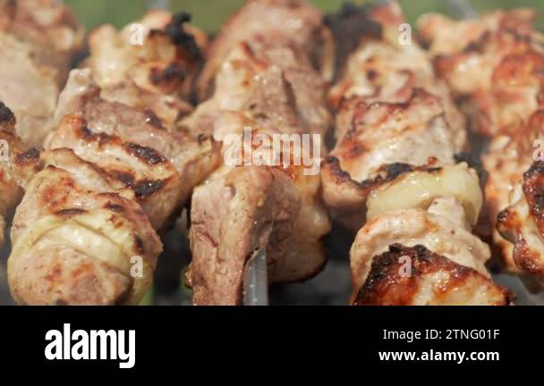 Preparation of meat on charcoal in the street. Chicken and pork are ...