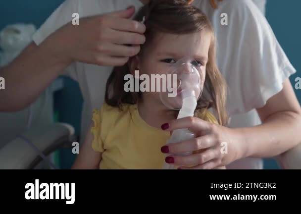 one toddler using nebulizer at home small girl child using vapor steam ...