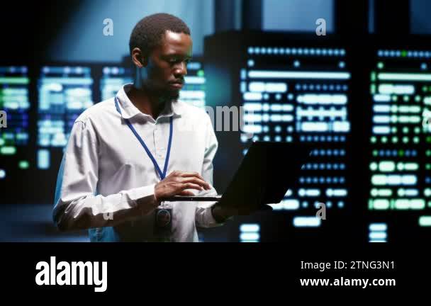 Computer Scientist Using Tablet To Analyze Server Cabinets Providing Computing Resources And 8629