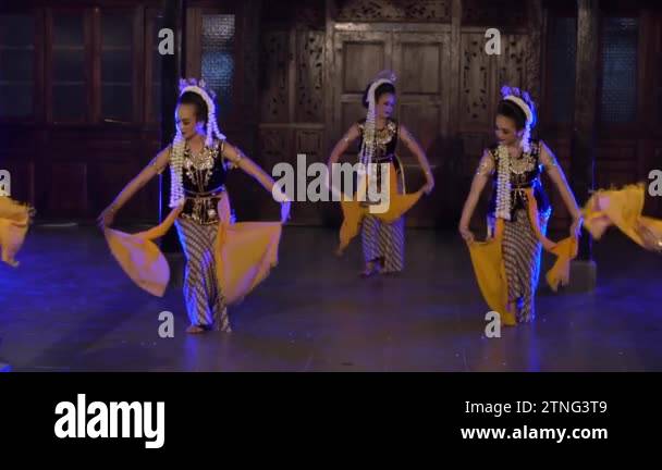 a group of Sundanese dancers take part in a dance competition at a ...