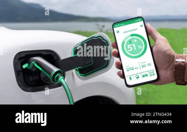 Businessman holding smartphone display battery status interface by ...