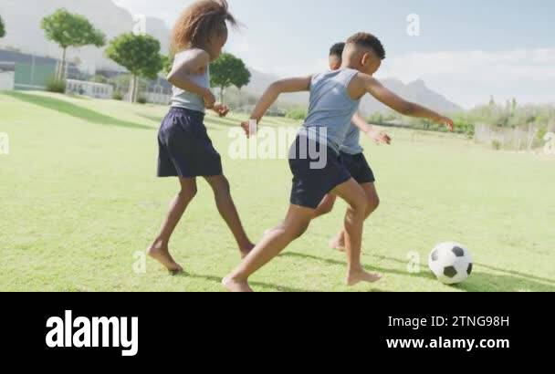 Video of three african american schoolchildren playing football ...