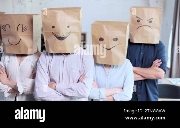 Diversity of emotions of employees. People standing in a line with paper bags on head expressive ...
