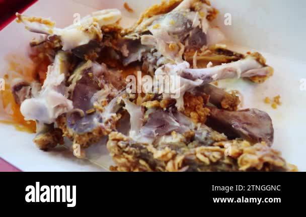 leftover chicken bones. Food waste concept and fresh waste in fast food ...