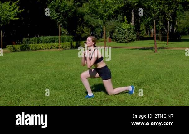 Determined active attractive sporty fit woman performing plyometric ...