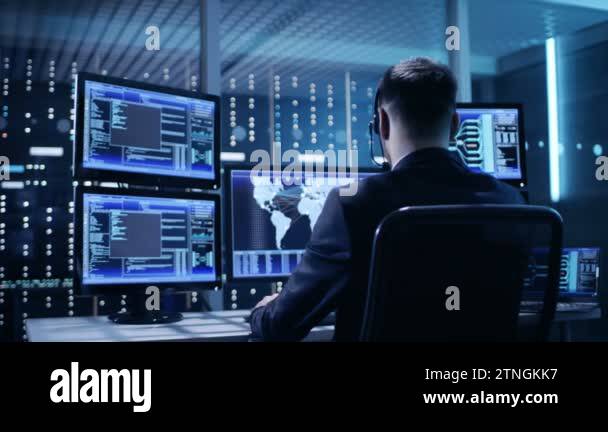 Back View of Technical Controller/ Operator Working at His Workstation ...